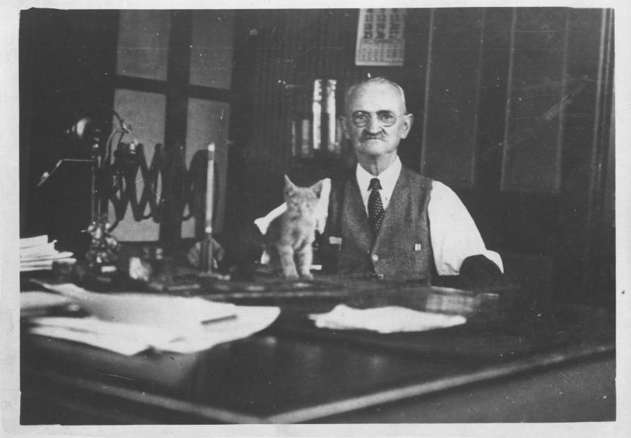 NKP Office Frankfort IN Mr. Fiesel with kitten. | The Nickel Plate Archive