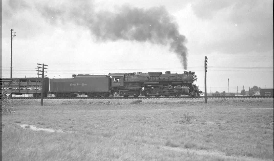 NKP S-2 763 Erie PA 5-26-1957 eb with stockcar | The Nickel Plate Archive