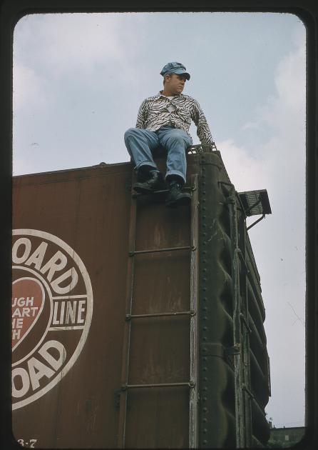 Worker riding on top of SAL boxcar | The Nickel Plate Archive